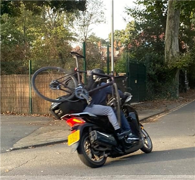 Cyclist dragged OFF his $8,000 bike by machete-wielding thugs